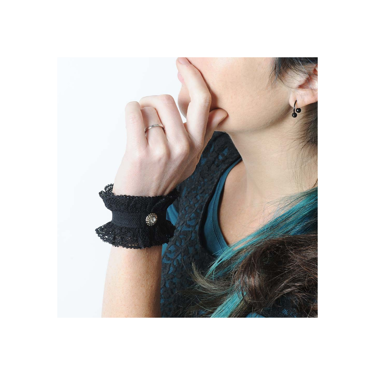Short black bracelet cuffs, lace ruffles and rhinestone